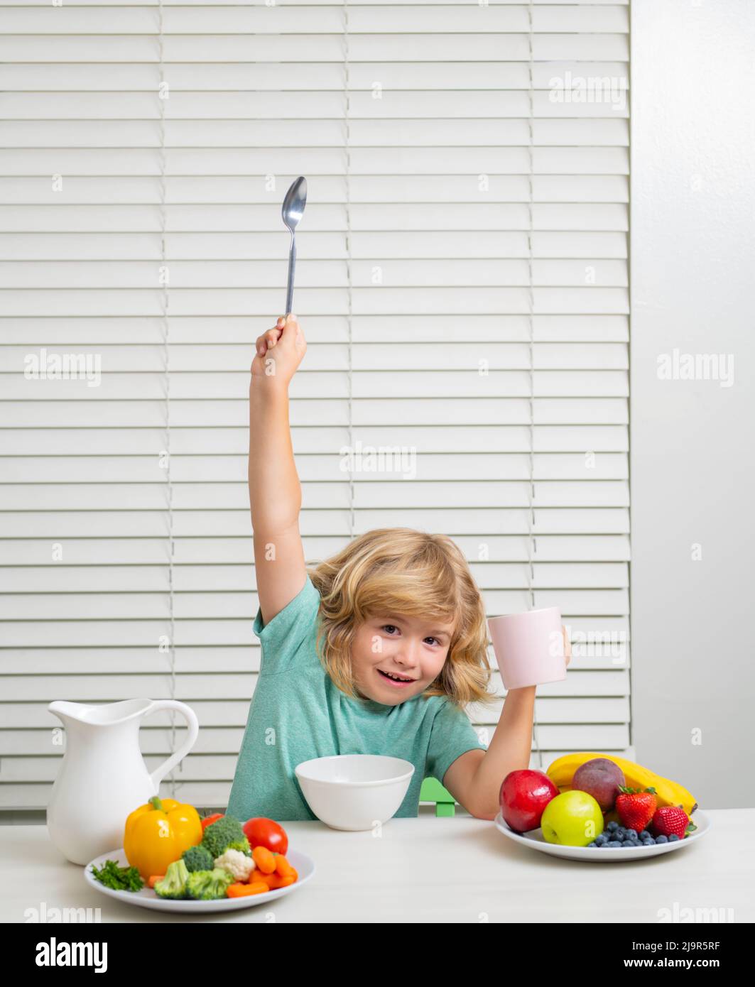 Child boy eating organic healthy food. Healthy vegetables with vitamins ...