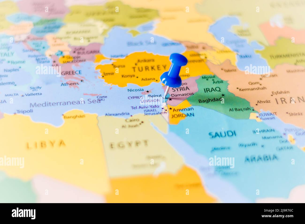 Blue push pin pointing at Syria on a political world map Stock Photo ...