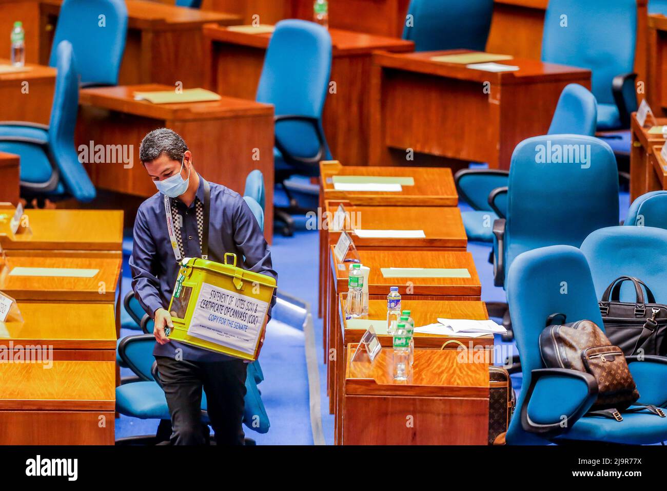 Quezon City. 24th May, 2022. An employee carries a ballot box during ...