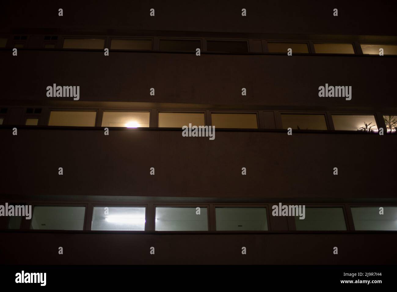 Windows in building at night. Light in house. Modern architecture in ...