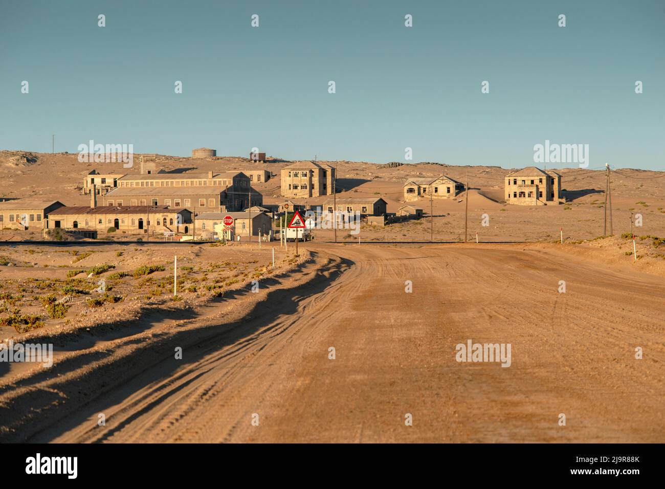 ruins of abandoned Kolmanskop town among sand dunes in desert of ...