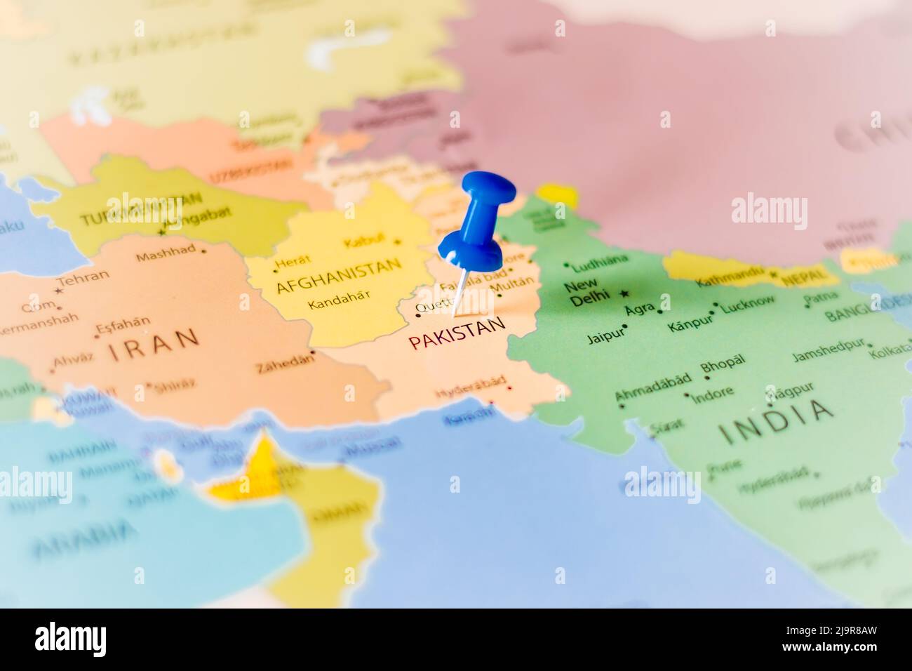 Blue push pin pointing at Pakistan on a political world map Stock Photo ...