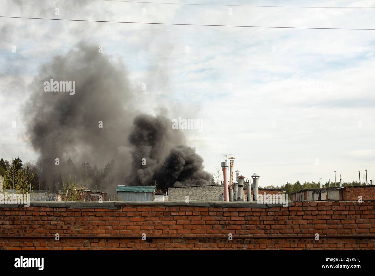 Burning of building. Smoke over buildings. Smoke in sky. Extreme ...