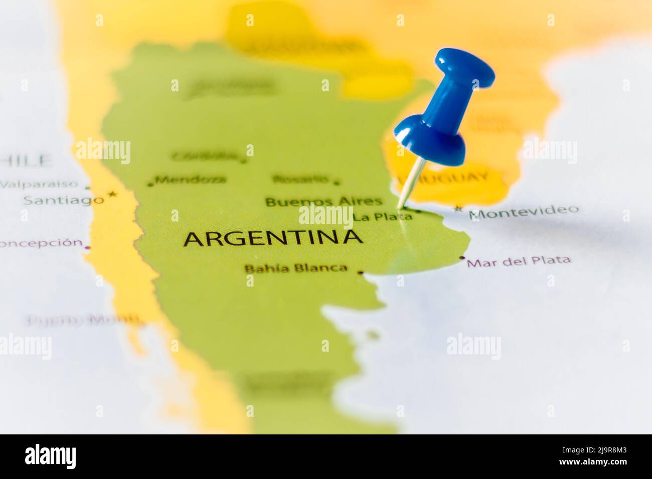 Blue push pin pointing at Buenos Aires, Argentina on a political world ...