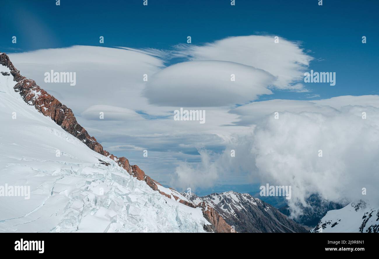 Lenticular clouds over Lake Pukaki. Strong winds and incoming weather ...