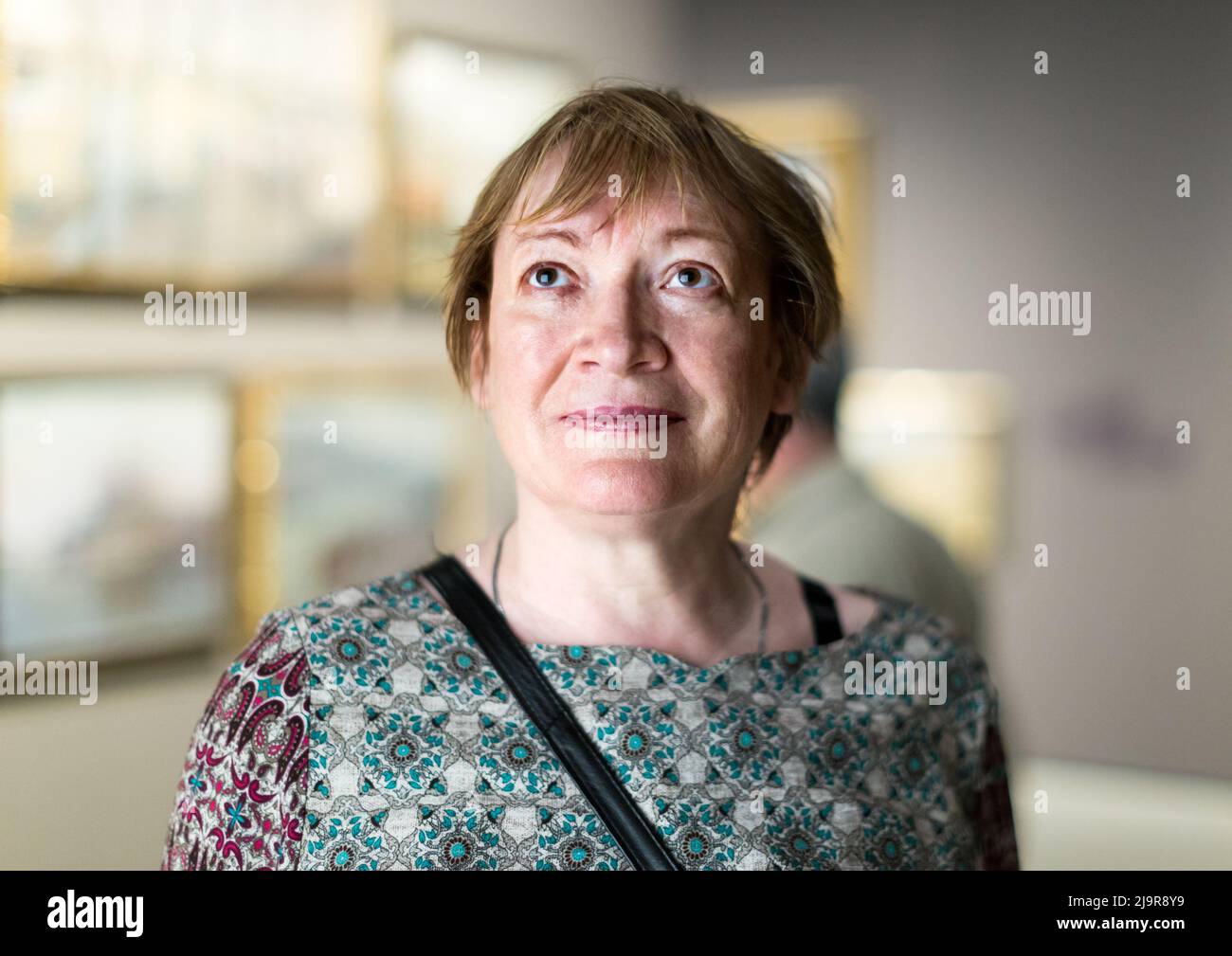 woman watching at art collection Stock Photo - Alamy
