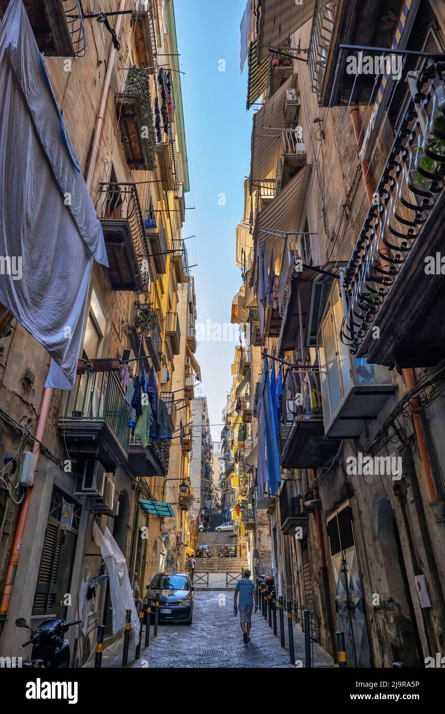 City of Naples in Italy, narrow street and old apartment buildings in ...