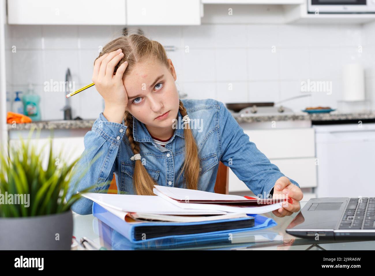 Tired of learning teenage schoolgirl Stock Photo - Alamy