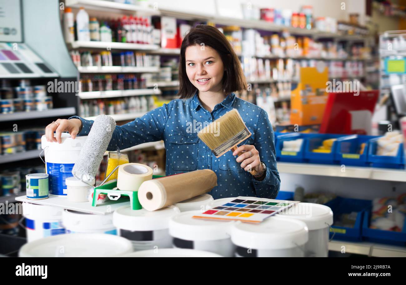 Young girl demonstrating tools for renovating Stock Photo - Alamy