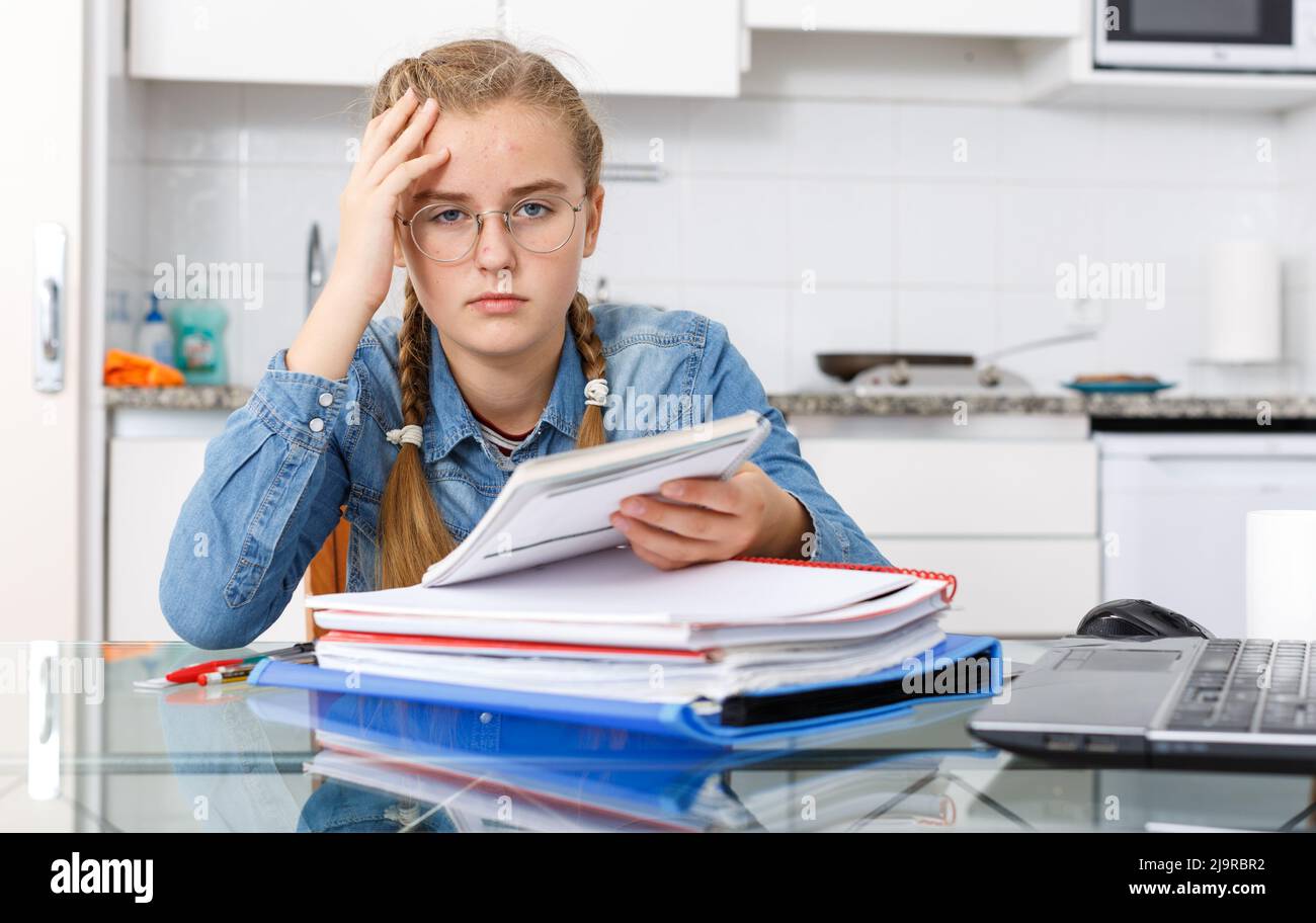 Girl tired of doing her homework Stock Photo - Alamy
