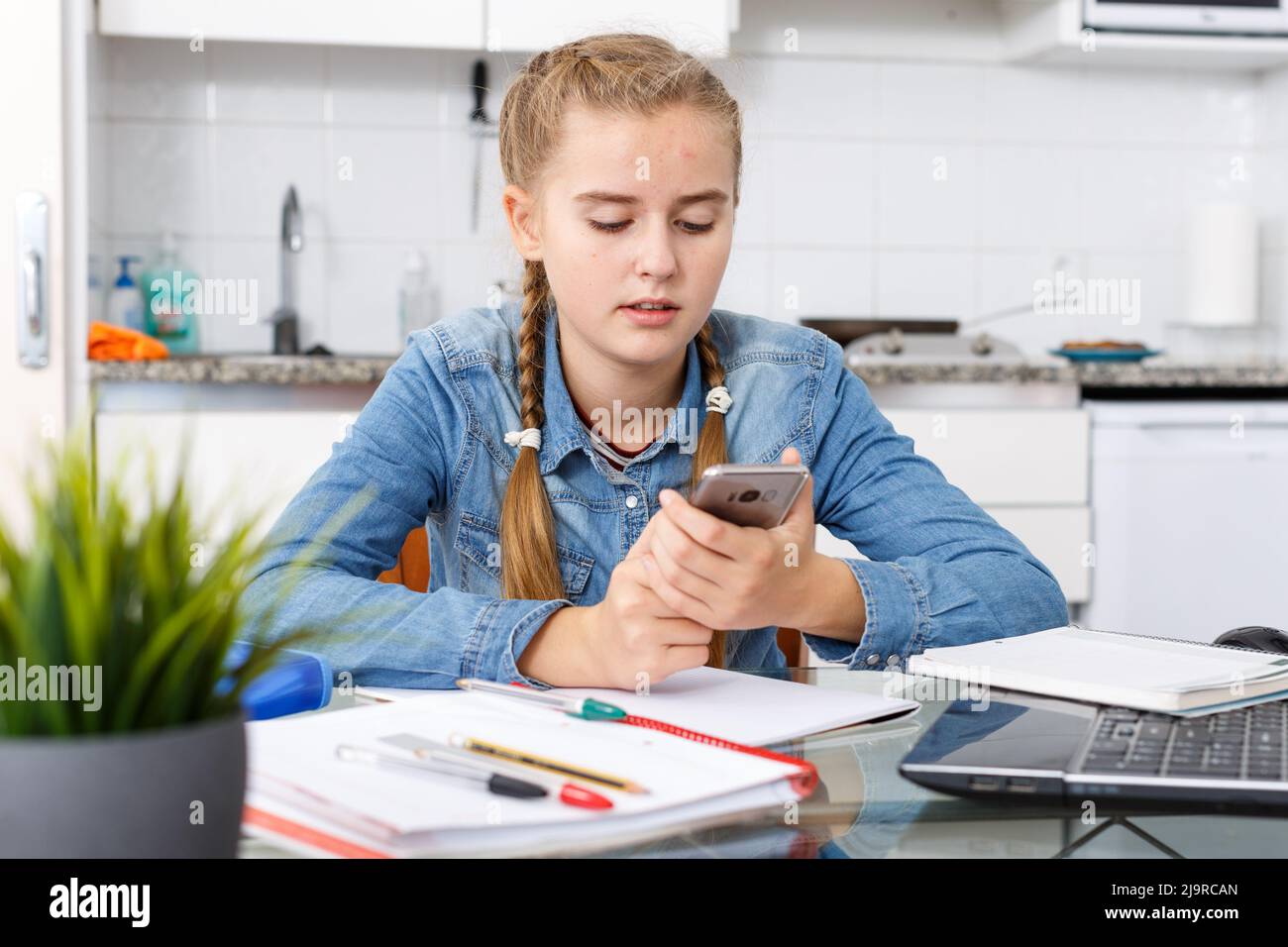 Portrait of girl doing herself home task Stock Photo - Alamy