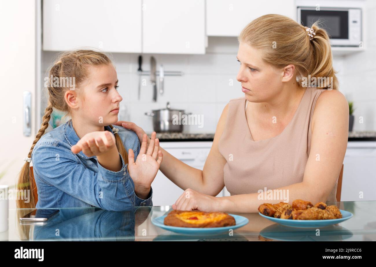 Mother and daughter having emotional dialog Stock Photo - Alamy