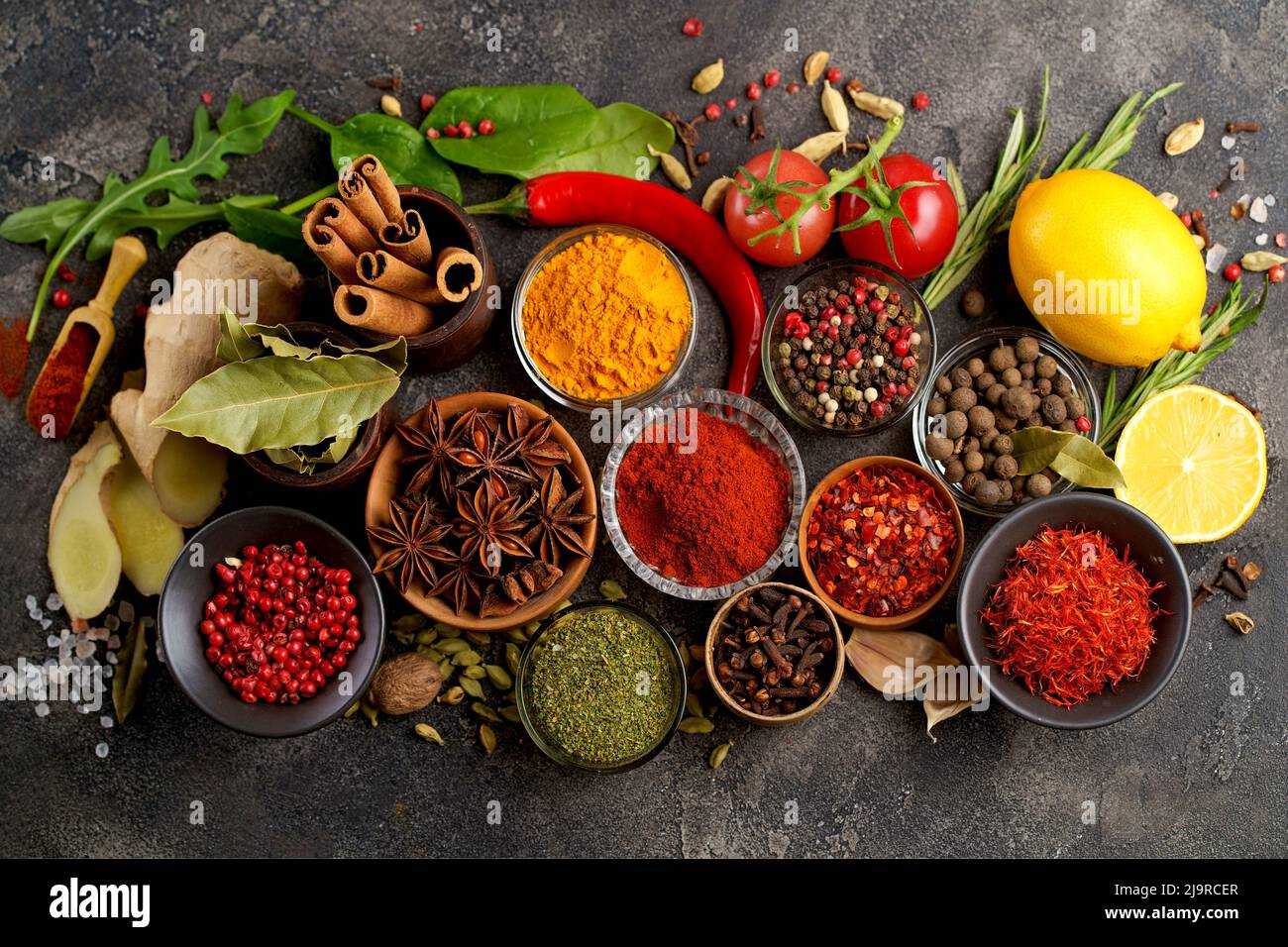 Herbs and spices in metal bowls. Food and cuisine ingredients. Colorful ...