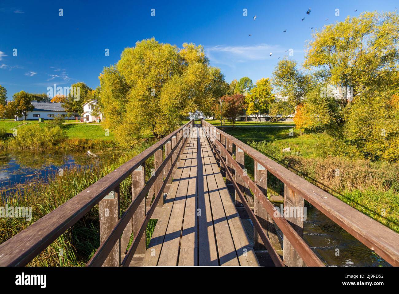 wide angle wooden bridge over river Stock Photo - Alamy