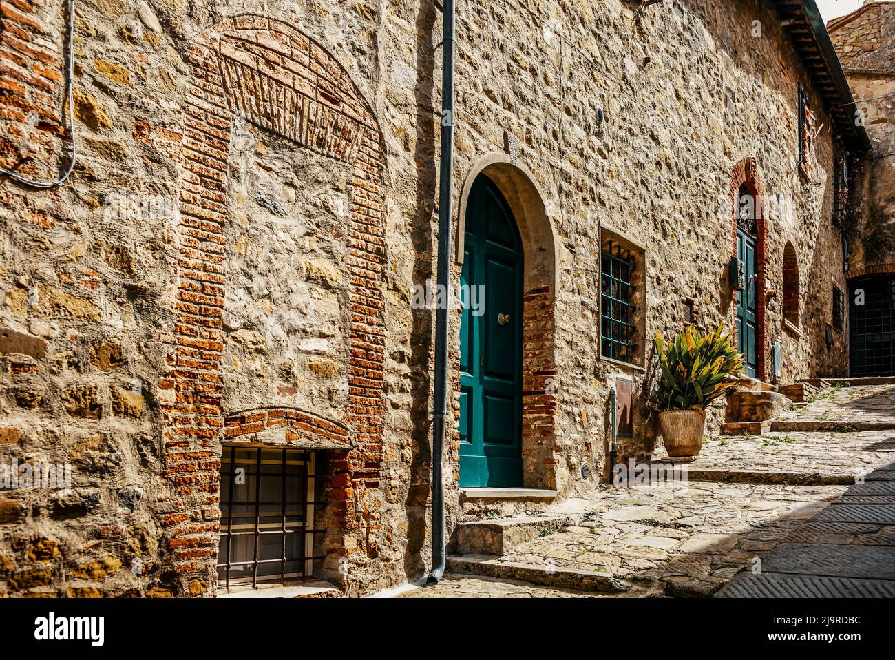 Narrow medieval lanes of Castiglione della Pescaia, an old village on ...