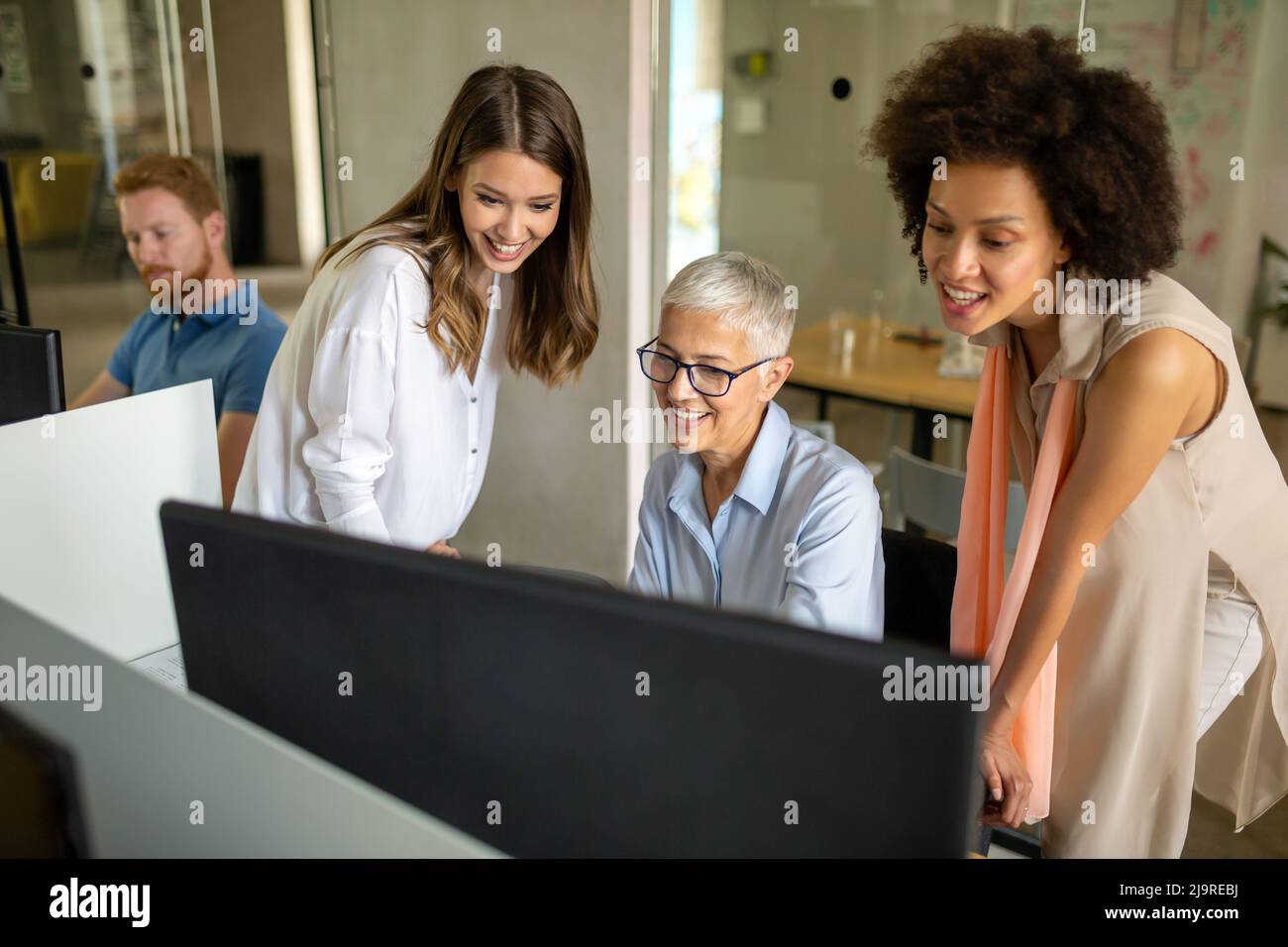 Group of programmer working in a software developing company office Stock Photo - Alamy