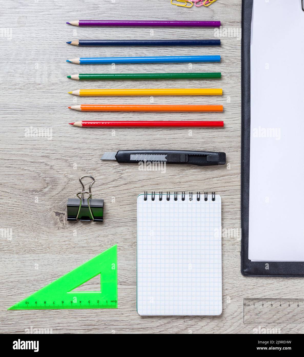 school supplies with pencils, paint pens paper scissors and rulers ...