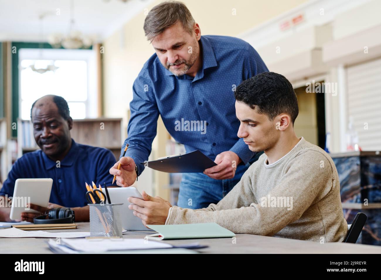 Mature teacher working immigrant hi-res stock photography and images ...