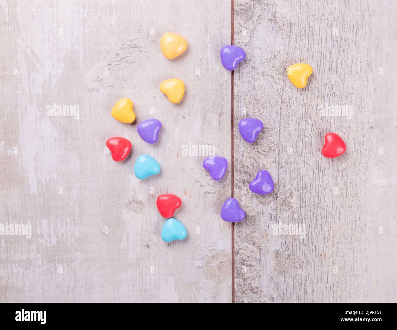 Candy hearts over wood. Valentines day background. Top view Stock Photo ...