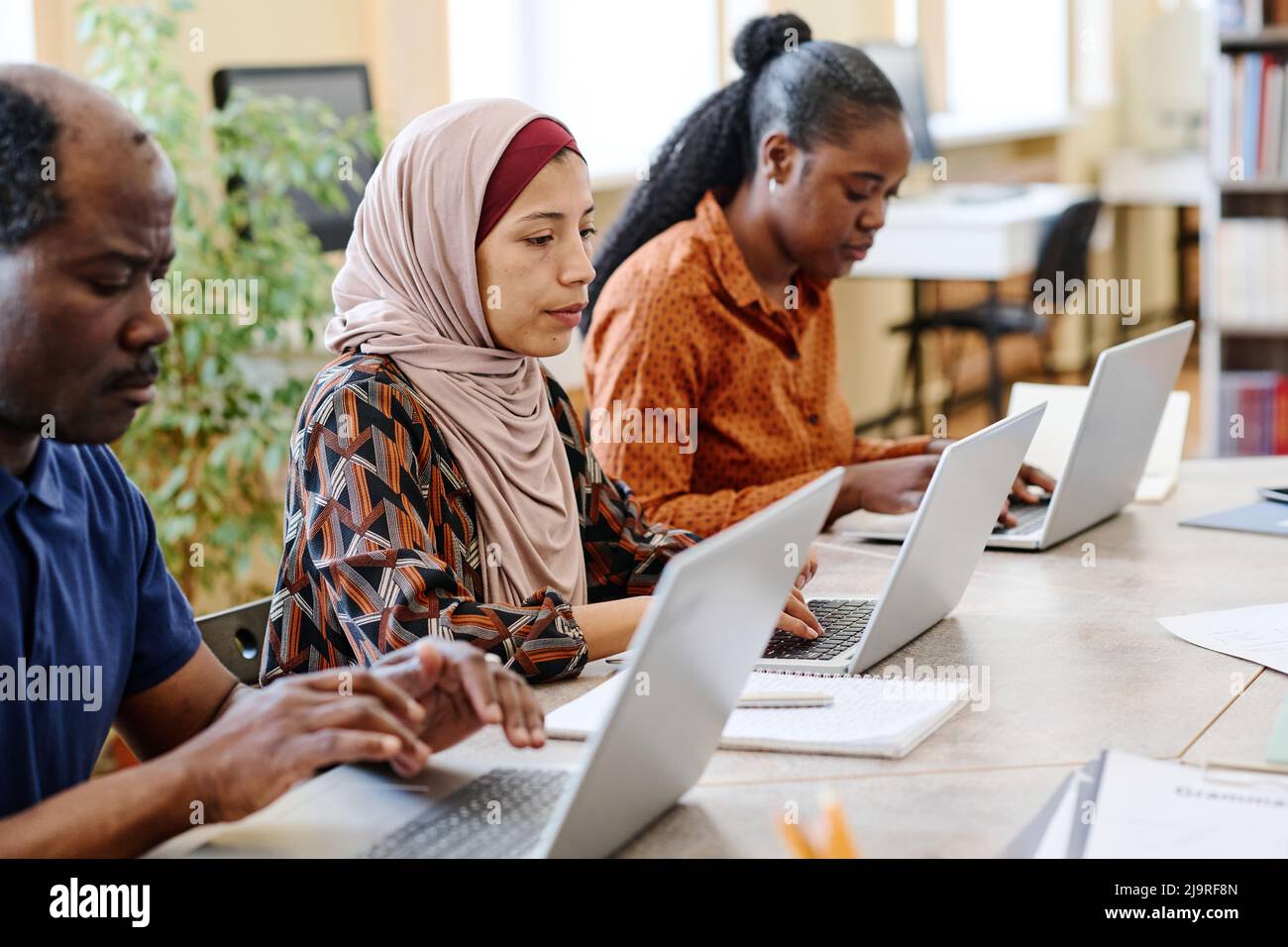 Black and Middle-Eastern immigrants attending English language class ...