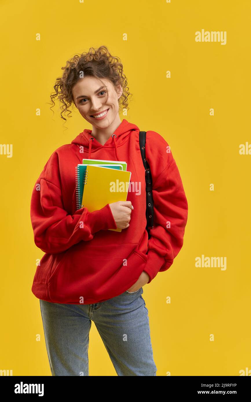 Front view of beautiful student in red khudi standing, looking at ...