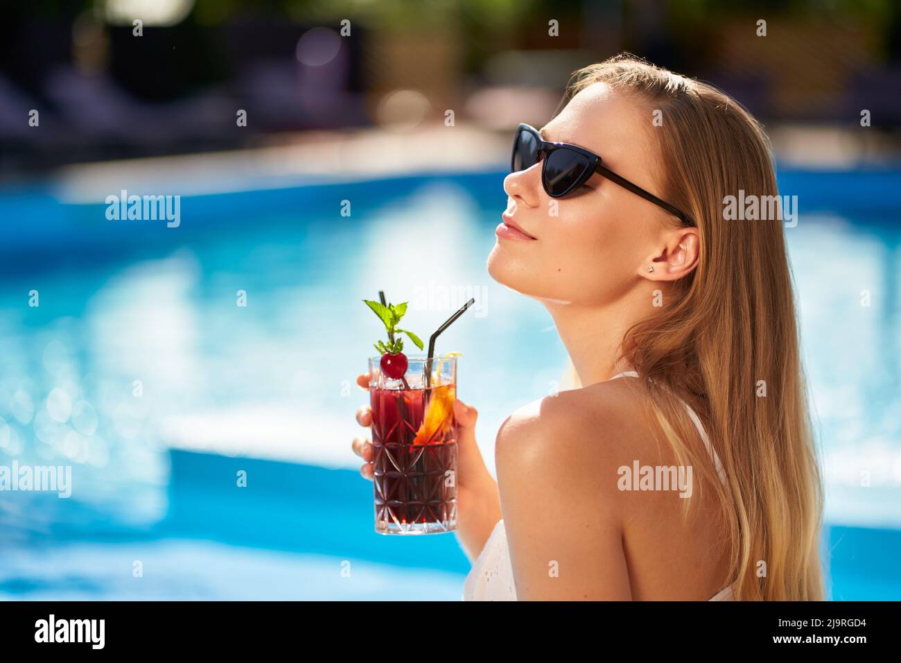 Blonde woman enjoying sunbathing in hi-res stock photography and images - Alamy
