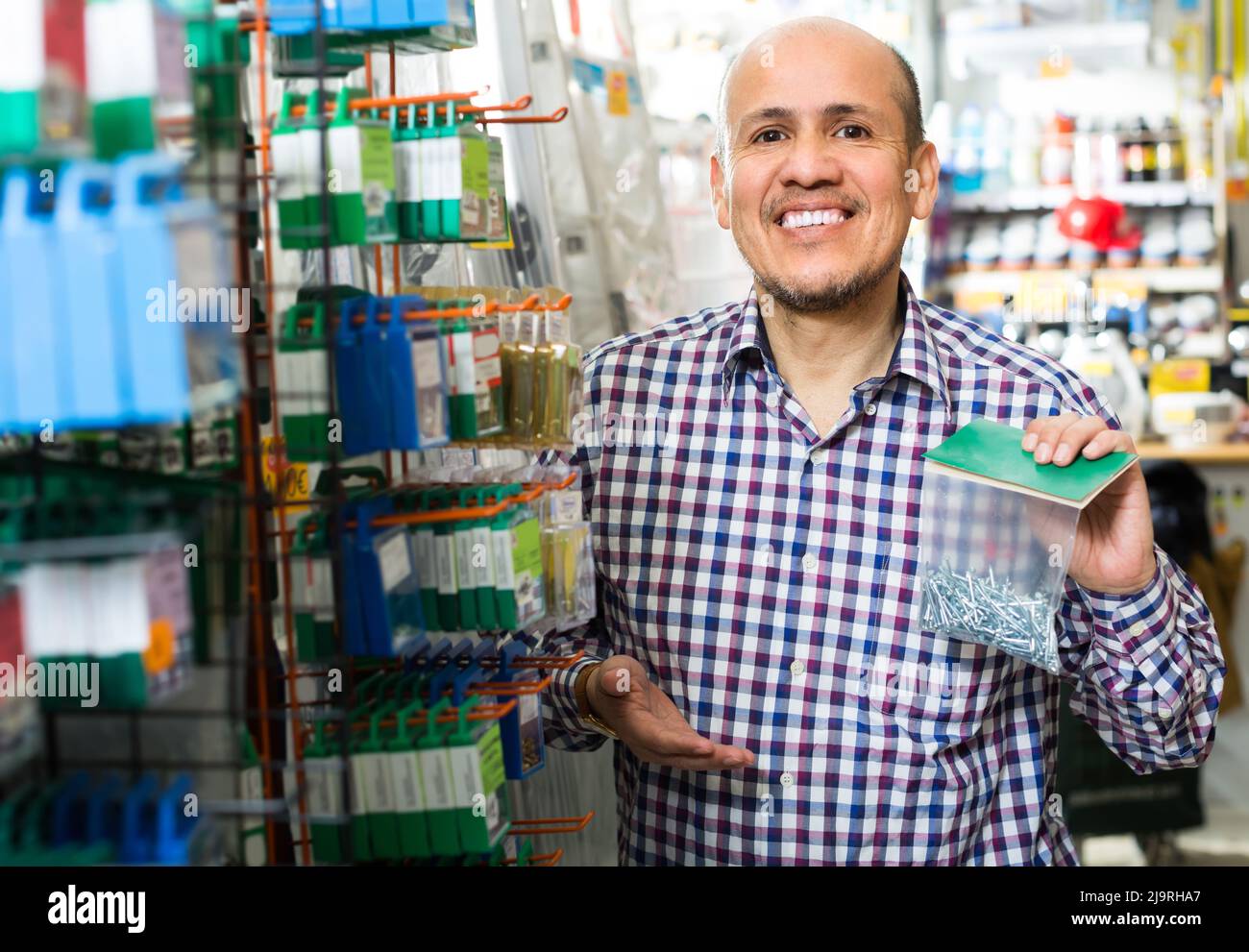 Customer buying nails and clinkers in store Stock Photo - Alamy