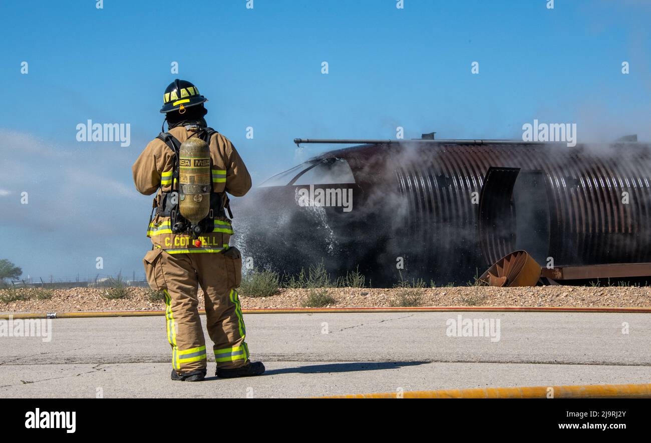 A reserve firefighter from the 419th Civil Engineer Squadron watches an ...