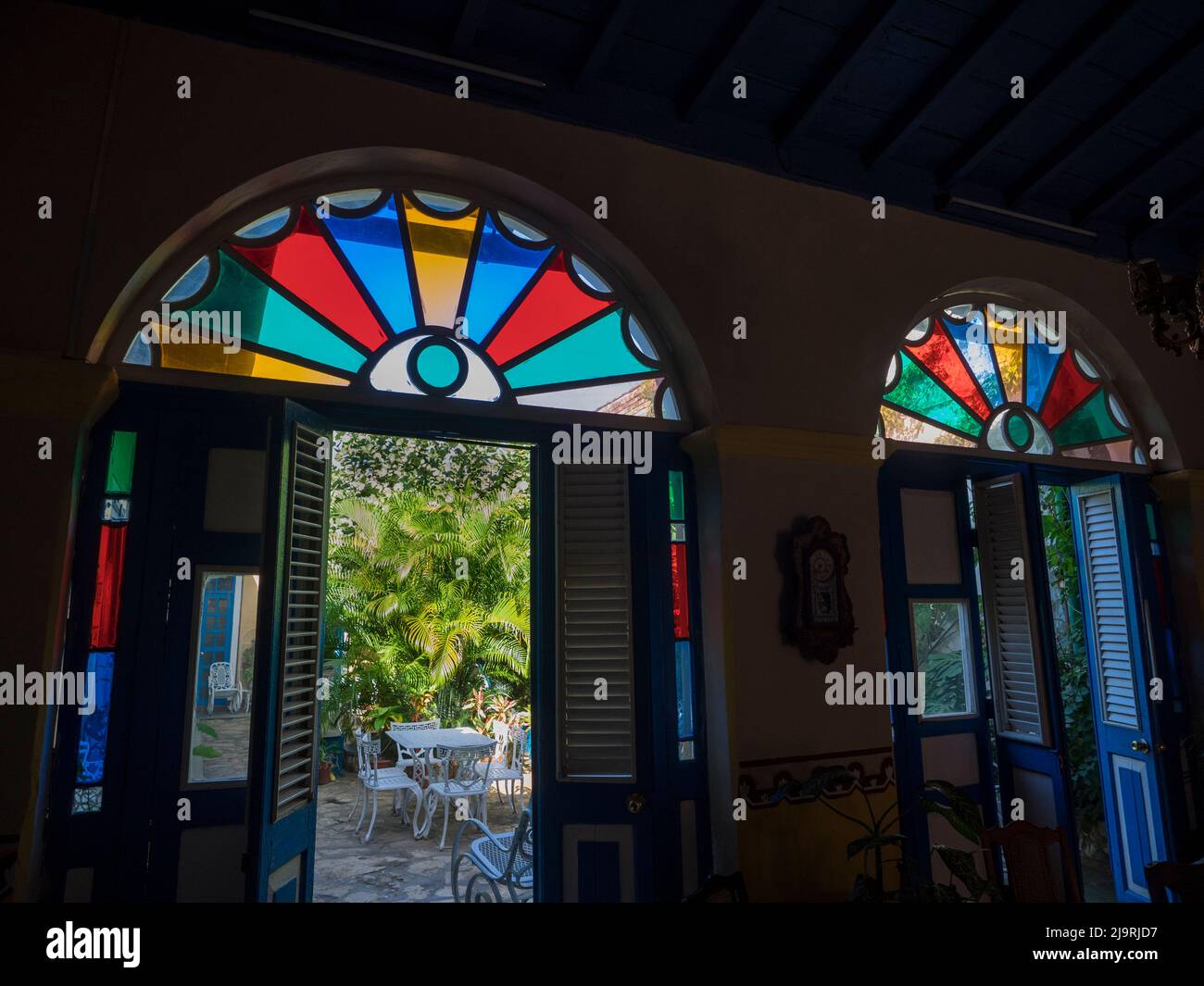 Cuba, Remedios, stained glass windows and courtyard in Casa Particular ...