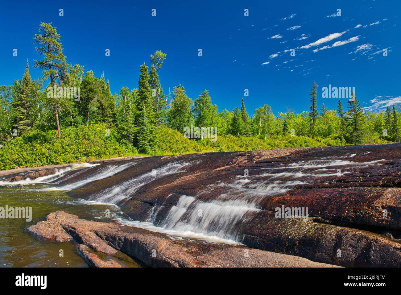 Canada, Manitoba, Whiteshell Provincial Park. Waterfall over rock ...