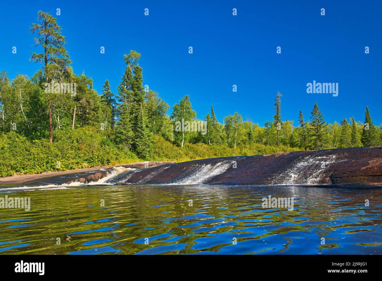 Canada, Manitoba, Whiteshell Provincial Park. Waterfall over rock ...