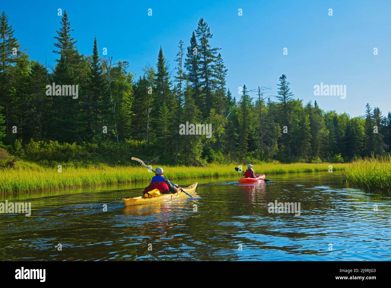 Canada, Manitoba, Whiteshell Provincial Park. People boating on river ...