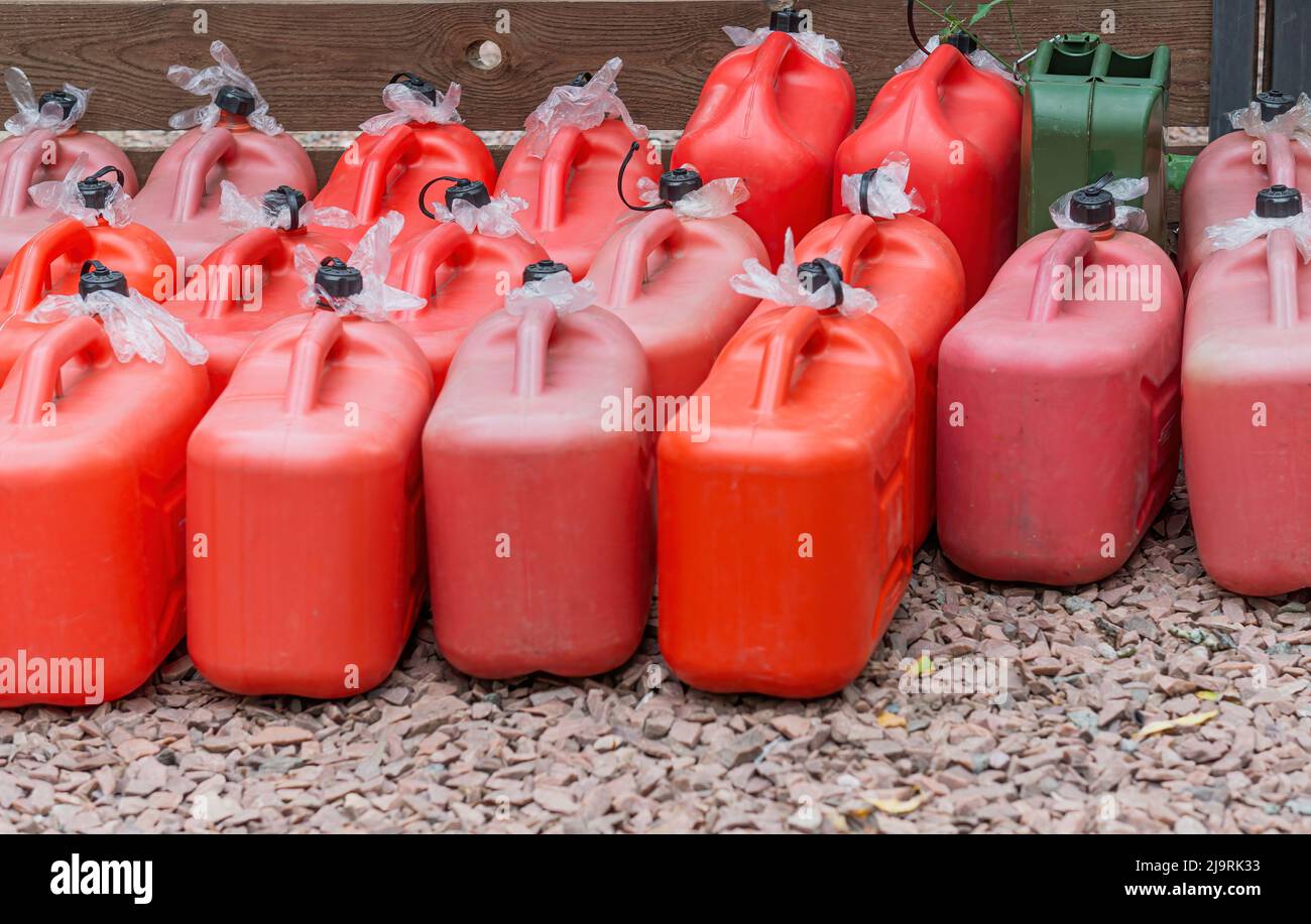Large group of red fuel containers, selective focus Stock Photo - Alamy