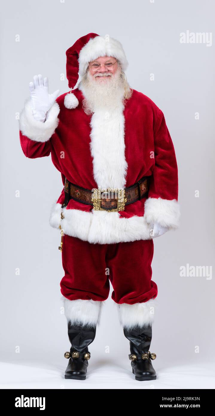 Full-length portrait of Santa Claus waving Stock Photo - Alamy