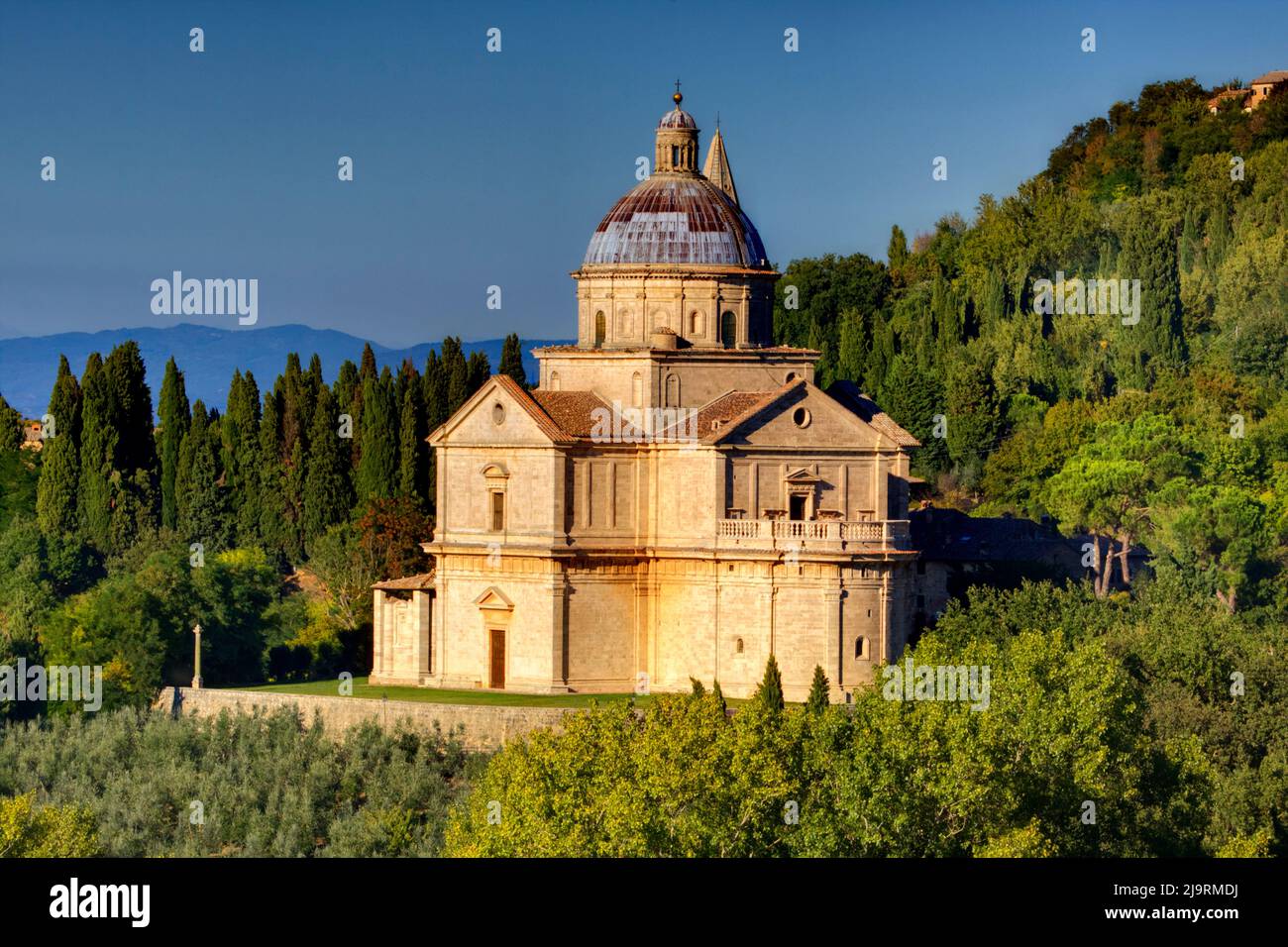 Italy, Tuscany. San Biaggio Church below the hilltop village of ...