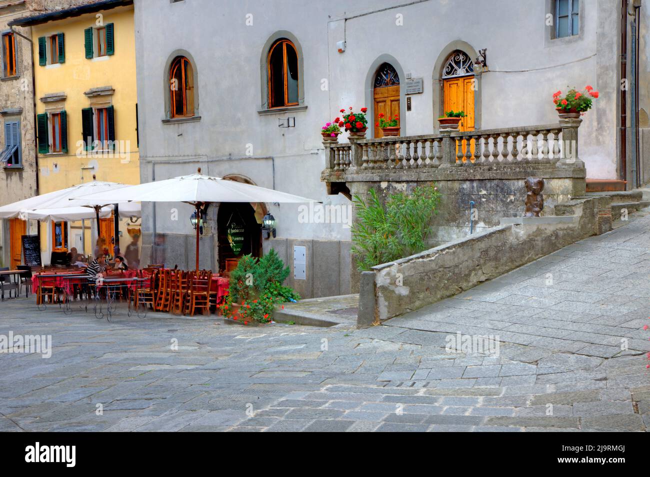 Italy, Radda in Chianti. Outdoor restaurant along the streets of Radda ...