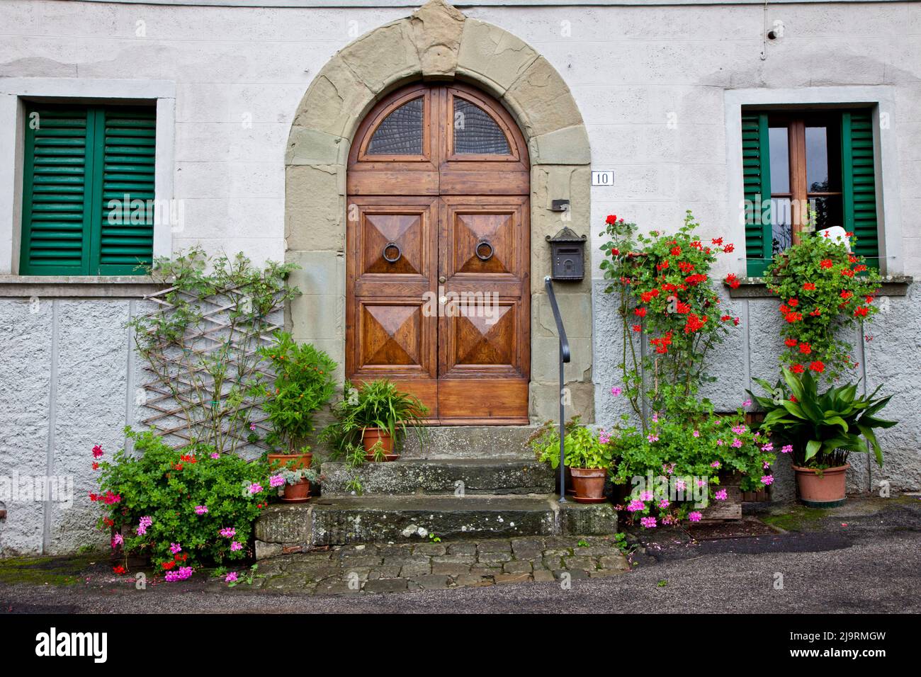Italy, Radda in Chianti. Entrance to homes along the streets of Radda ...