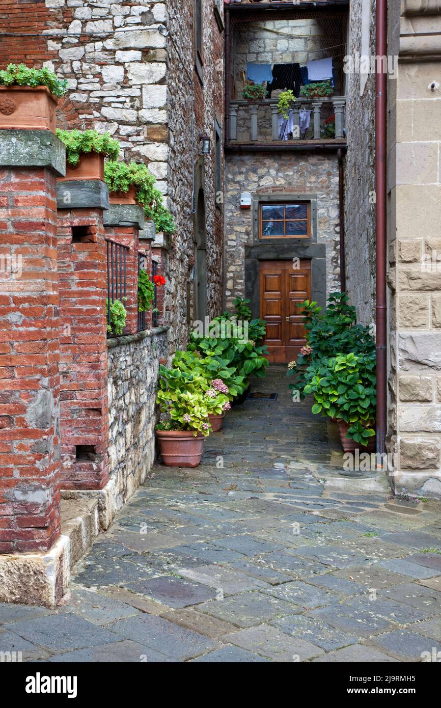 Italy, Radda in Chianti. Entrance to homes along the streets of Radda ...