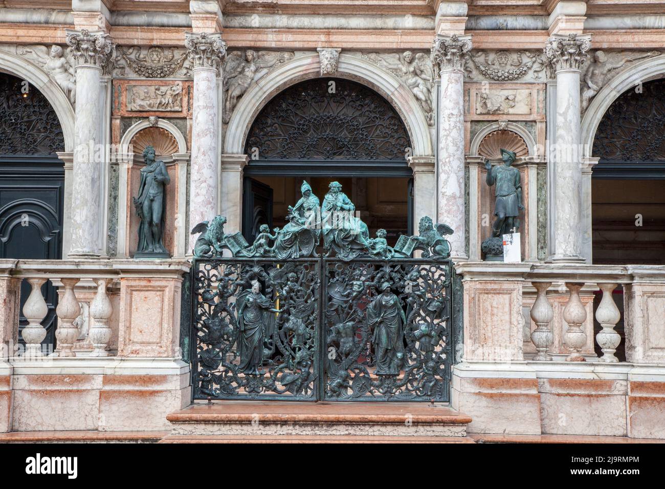 Italy, Venice. The bronze gate at the base of the bell tower in Saint ...