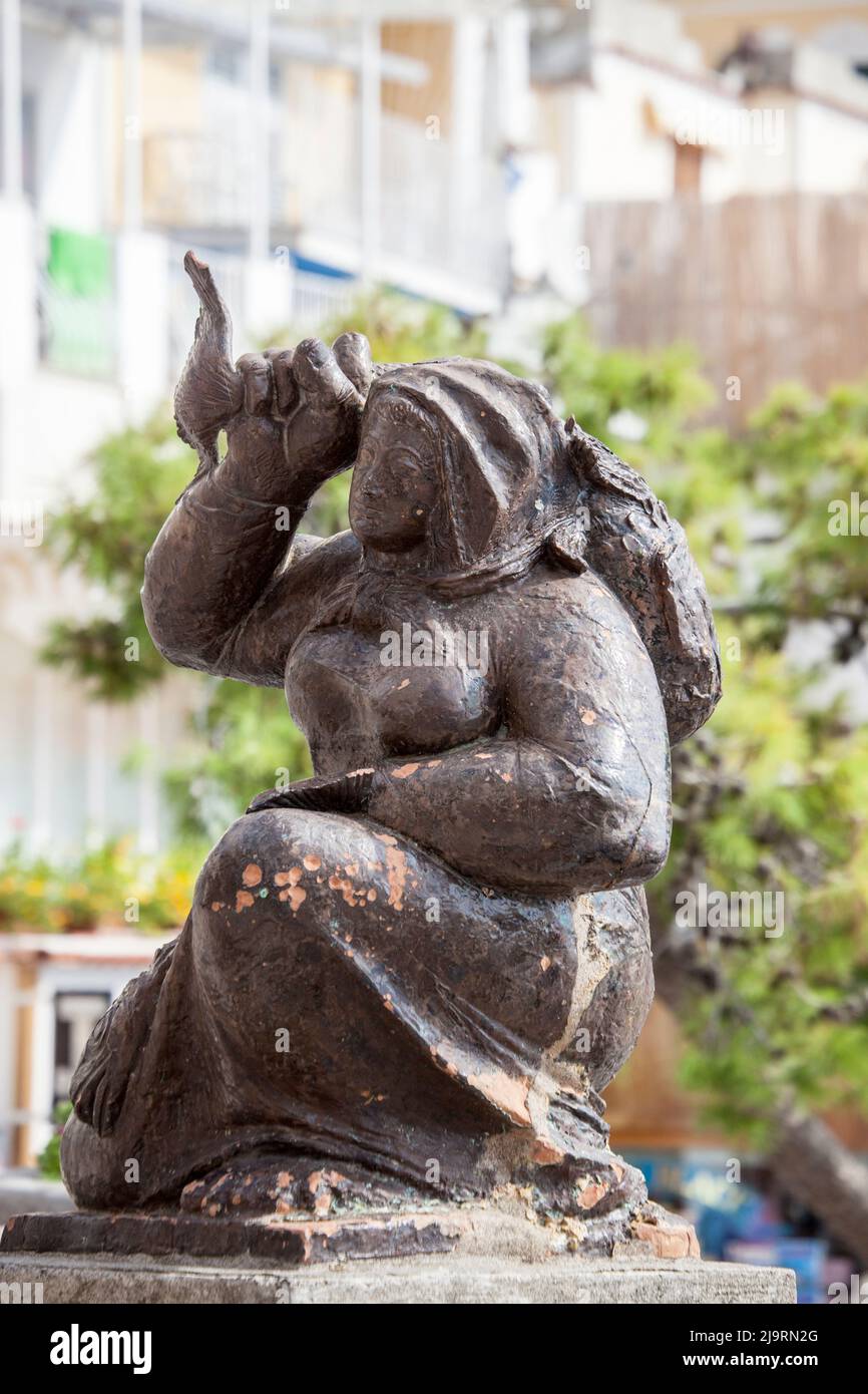 Italy, Positano. Statue of Fisher Woman in the town square of Positano ...