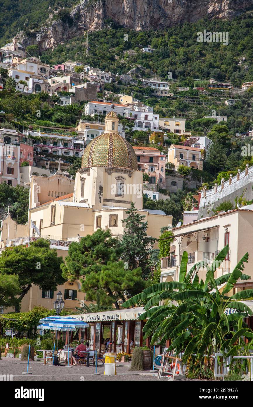 Italy, Positano. Church of Santa Maria Assunta and a restaurant in the ...