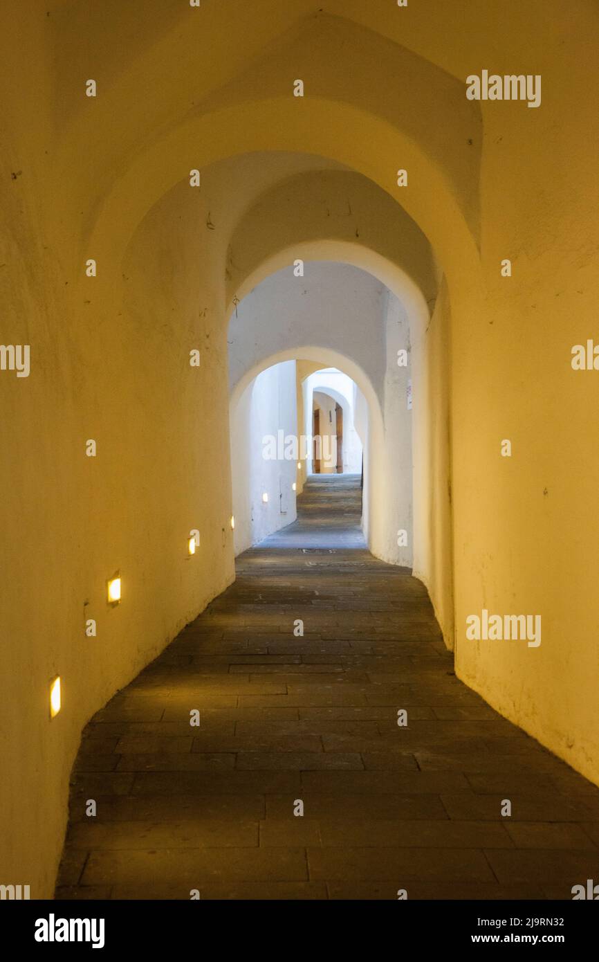 Italy, Amalfi. Arched yellow walkway leading to homes in the coastal ...