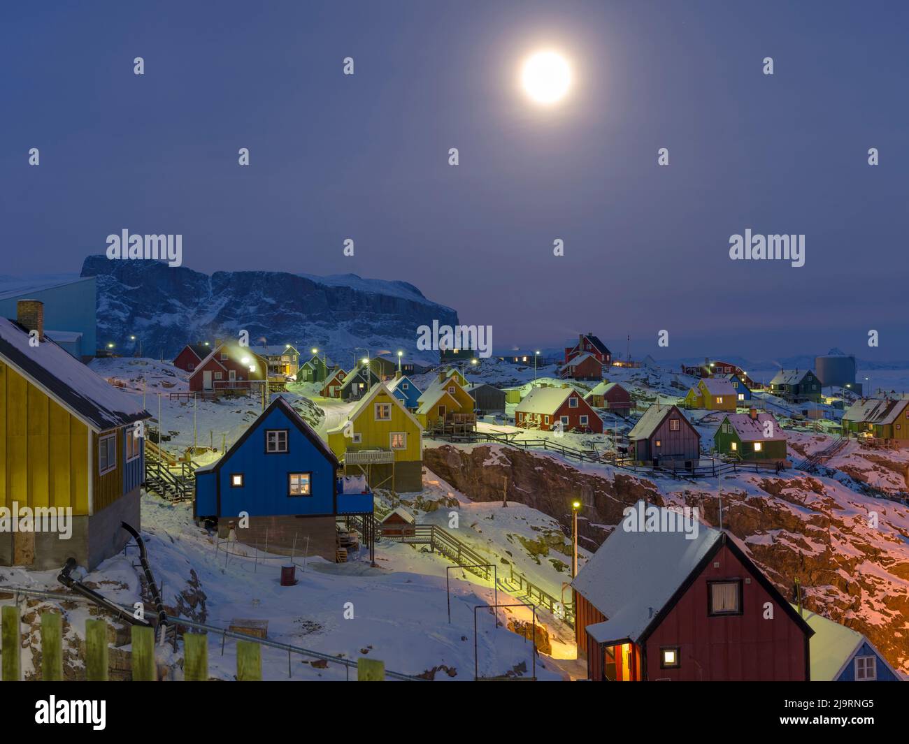 Arctic night and full moon over Uummannaq during winter in northern ...