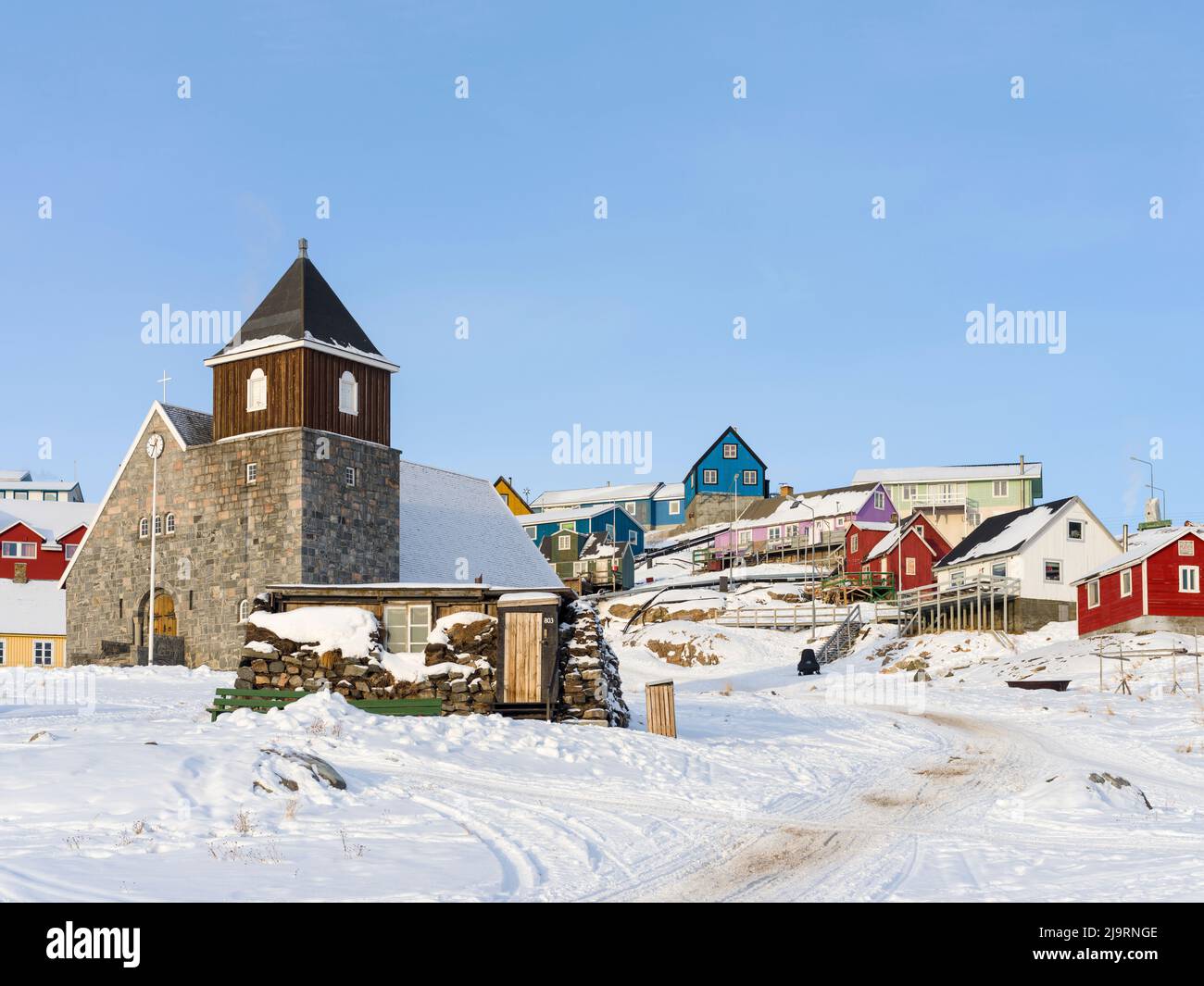 The church. Town Uummannaq during winter in northern West Greenland ...