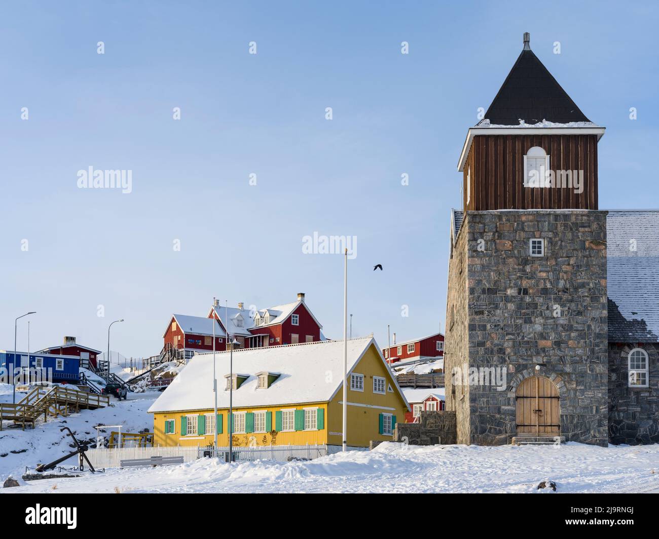 The church. Town Uummannaq during winter in northern West Greenland ...