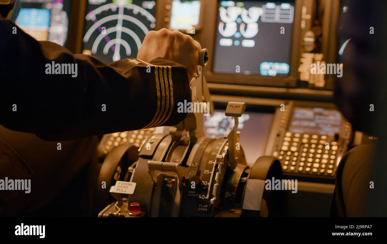 Aircraft captain in cockpit command taking off with airplane ...
