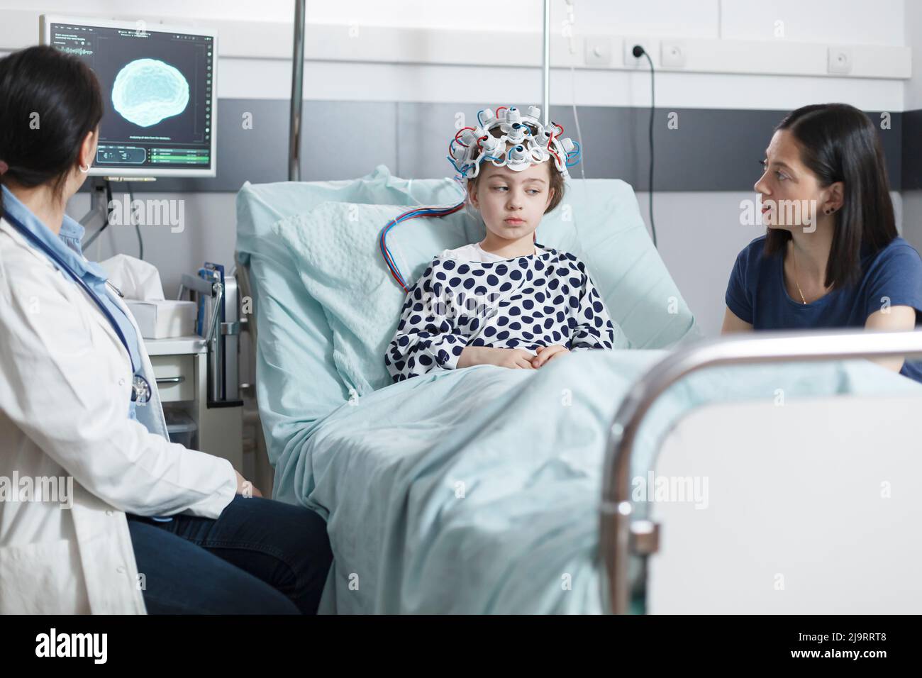Healthcare hospital pediatric medic analyzing EEG scan of unwell little ...