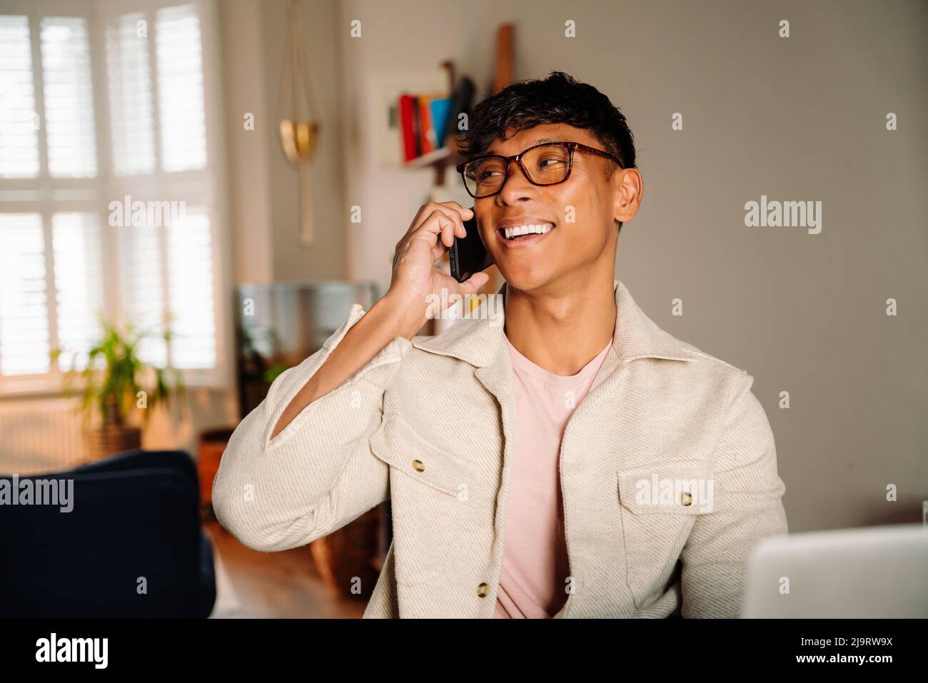 Asian man chatting on mobile hi-res stock photography and images - Alamy