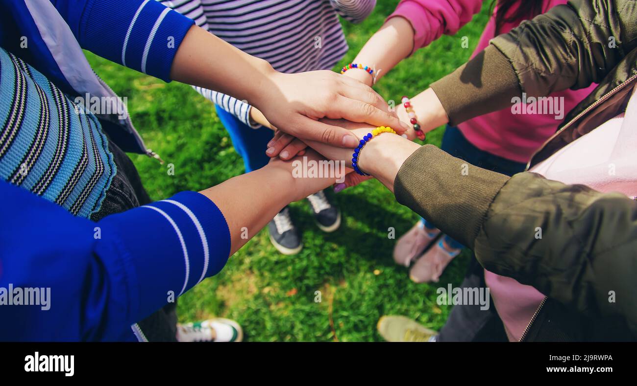 People put their hands together. Selective focus Stock Photo - Alamy