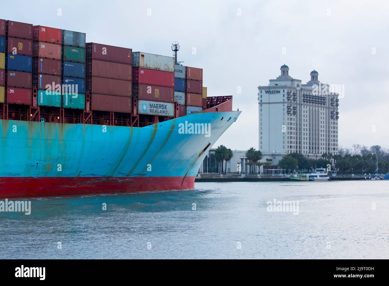 USA, Georgia, Savannah. Container ship leaving Savannah Harbor ...